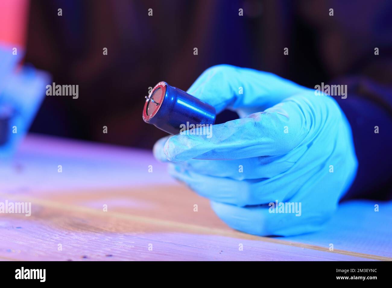 electric capacitor from the computer power supply in the hand on a ...