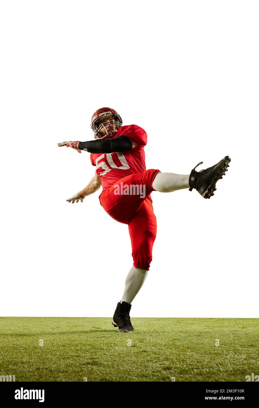 Kick the ball. Professional american football player in sports uniform ...