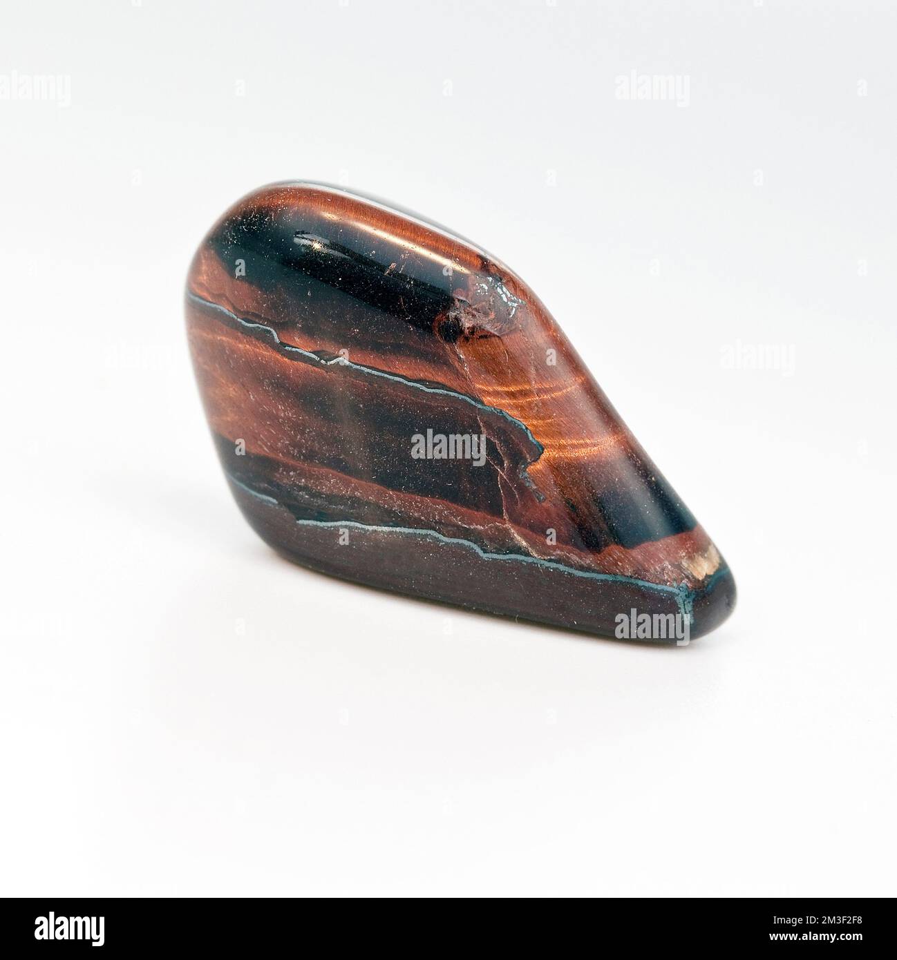 Macro close up colour photograph of ''Red Tigers Eye' ' a semi precious ...