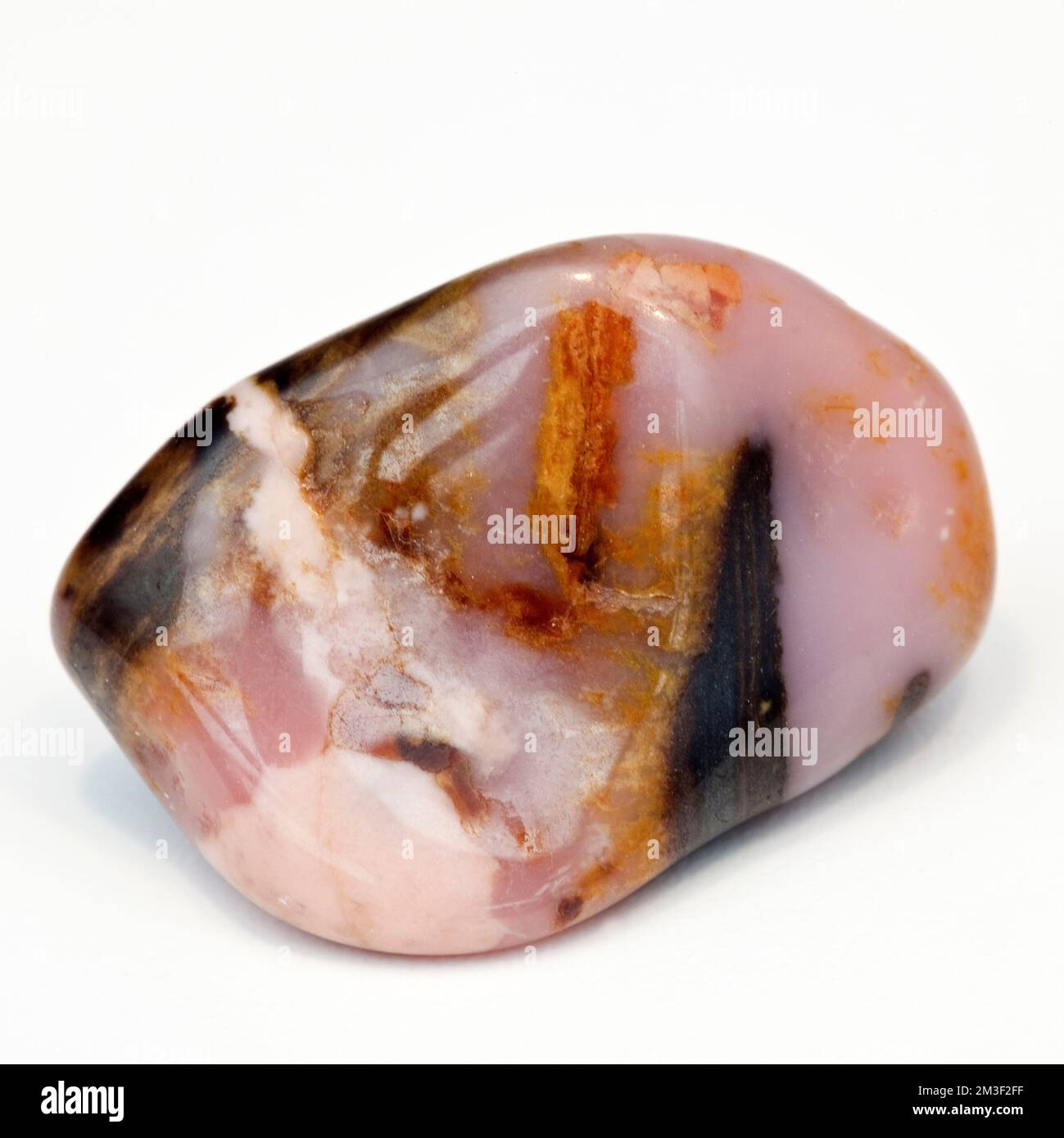 Macro close up colour photograph of 'Rhodonite' a semi precious crystal ...