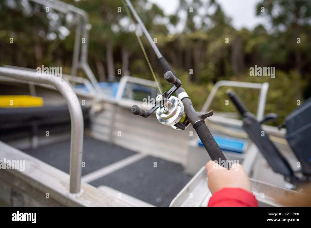 model girl fishing in a boat in summer in australia Stock Photo - Alamy