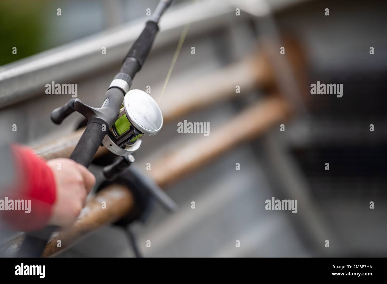 model girl fishing in a boat in summer in australia Stock Photo - Alamy