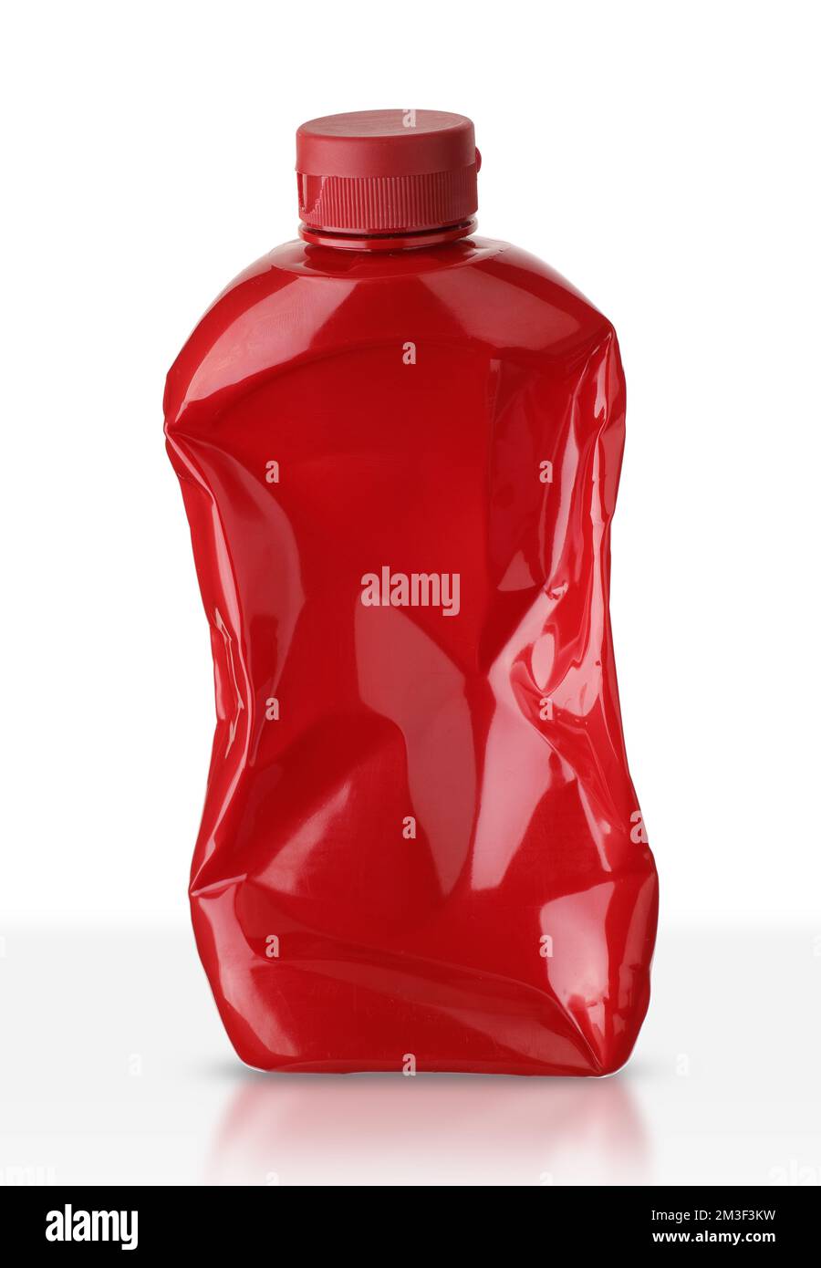 a crushed red ketchup bottle on a white background Stock Photo - Alamy