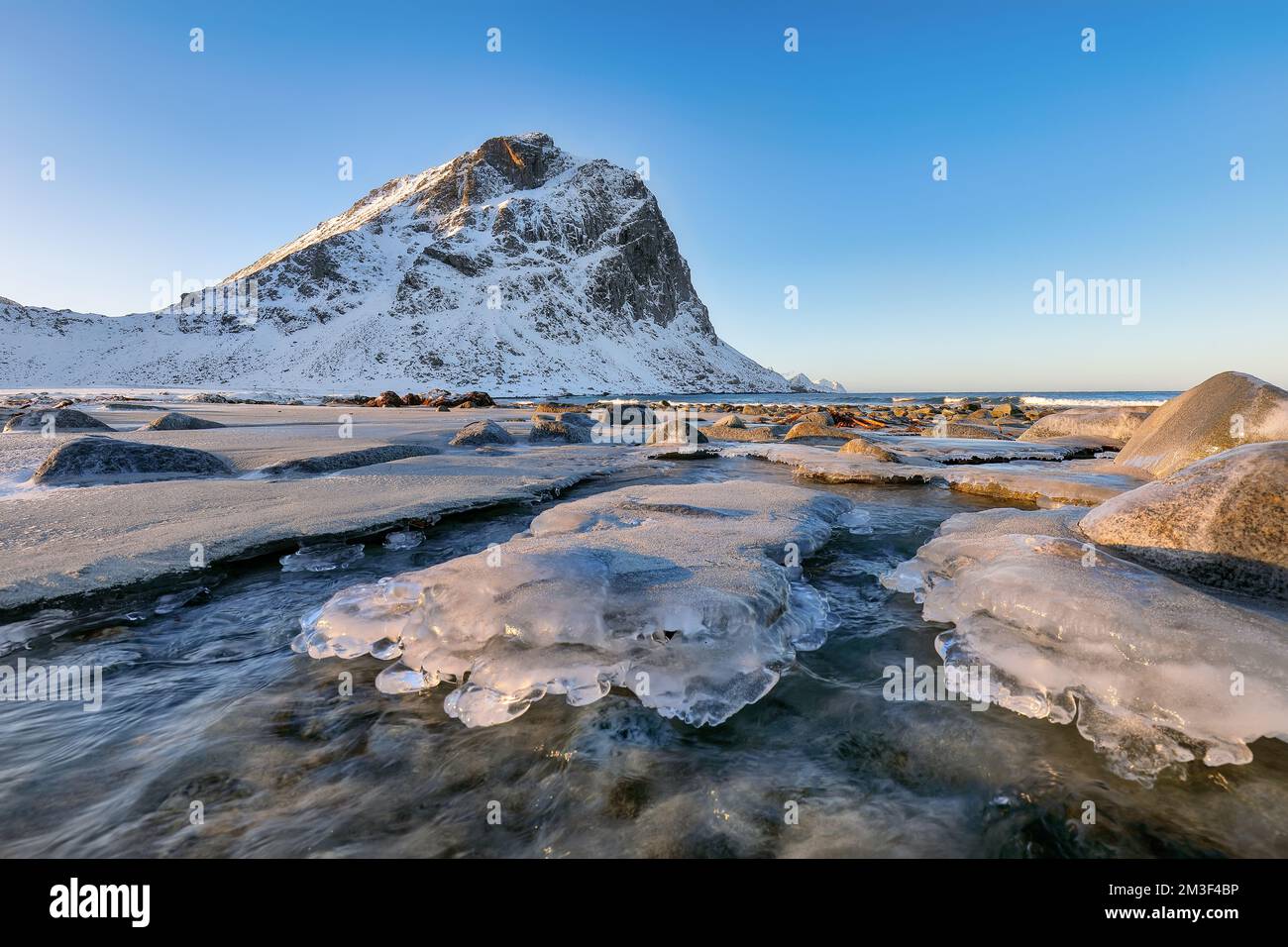 Breathtaking winter scenery on Uttakleiv beach at morning. Popular ...