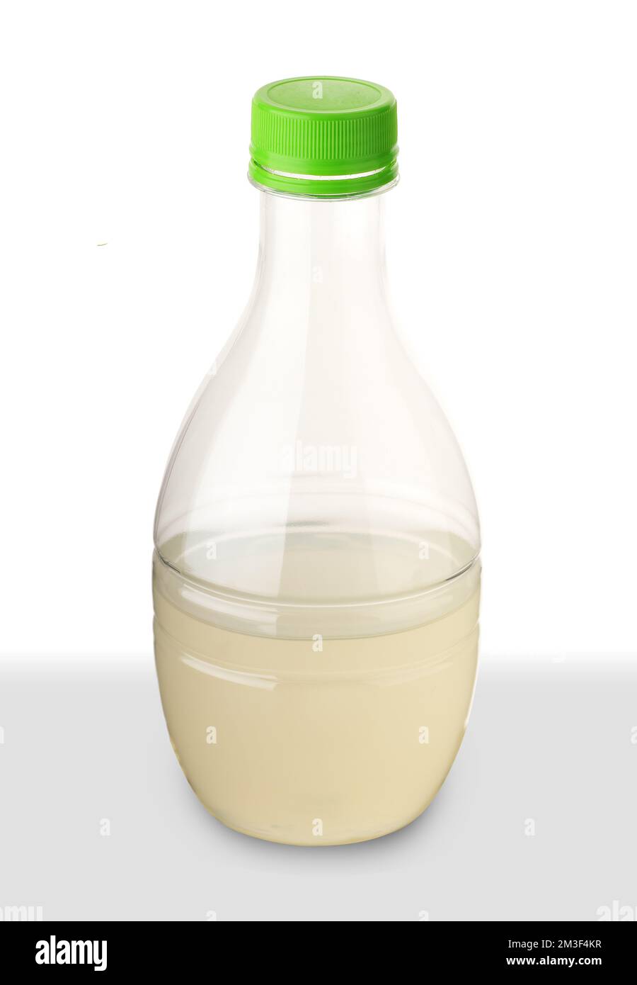 a small plastic bottle of lemonade on a white background Stock Photo ...