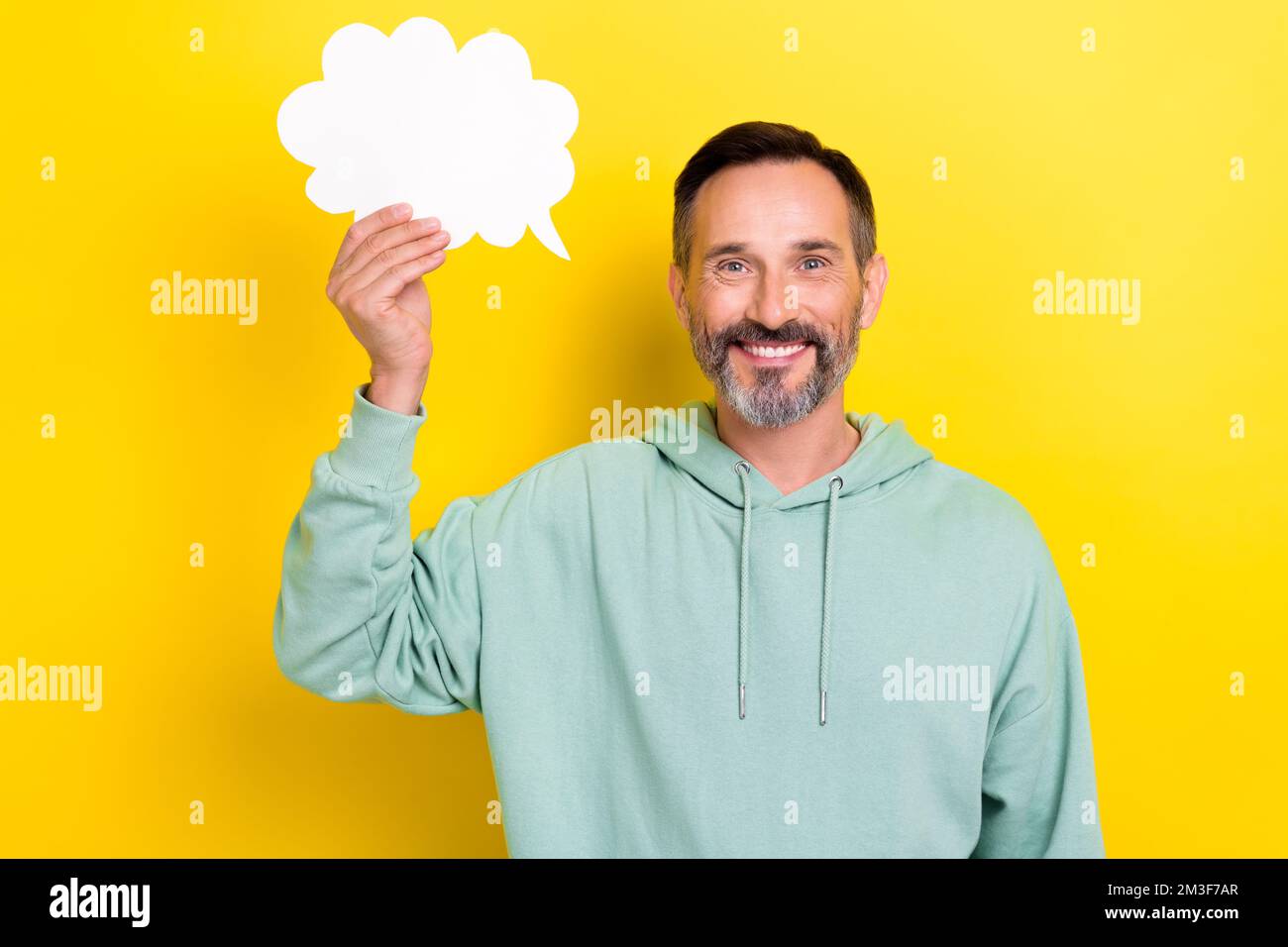 Photo of middle aged man grey bristle smile hold paper cloud empty ...