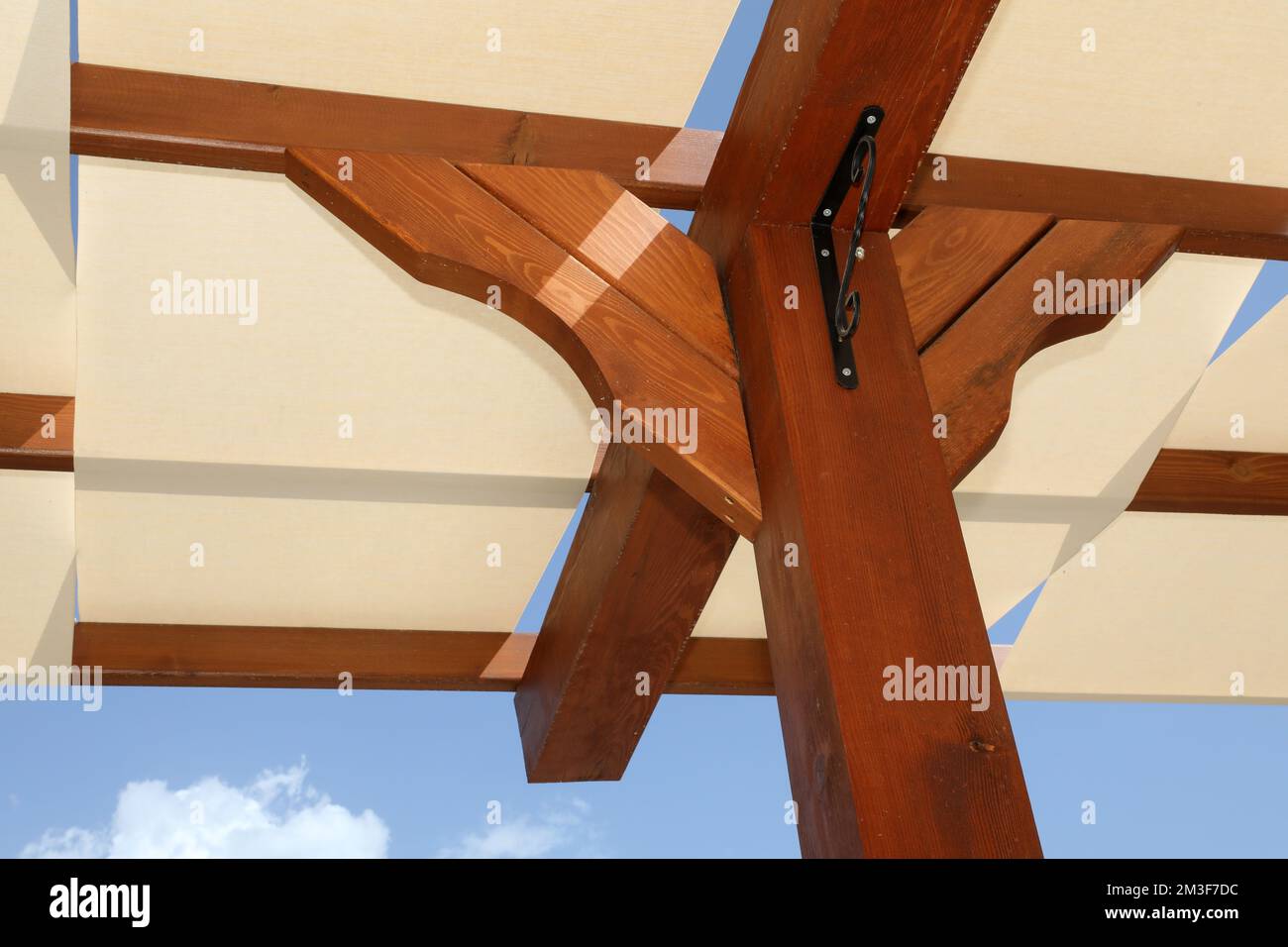 summer ceiling of wooden beams and white fabric and blue sky Stock ...