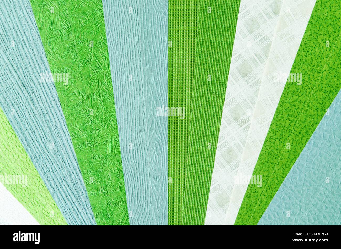A color swatch of green paper texture made from recycled paper is used ...