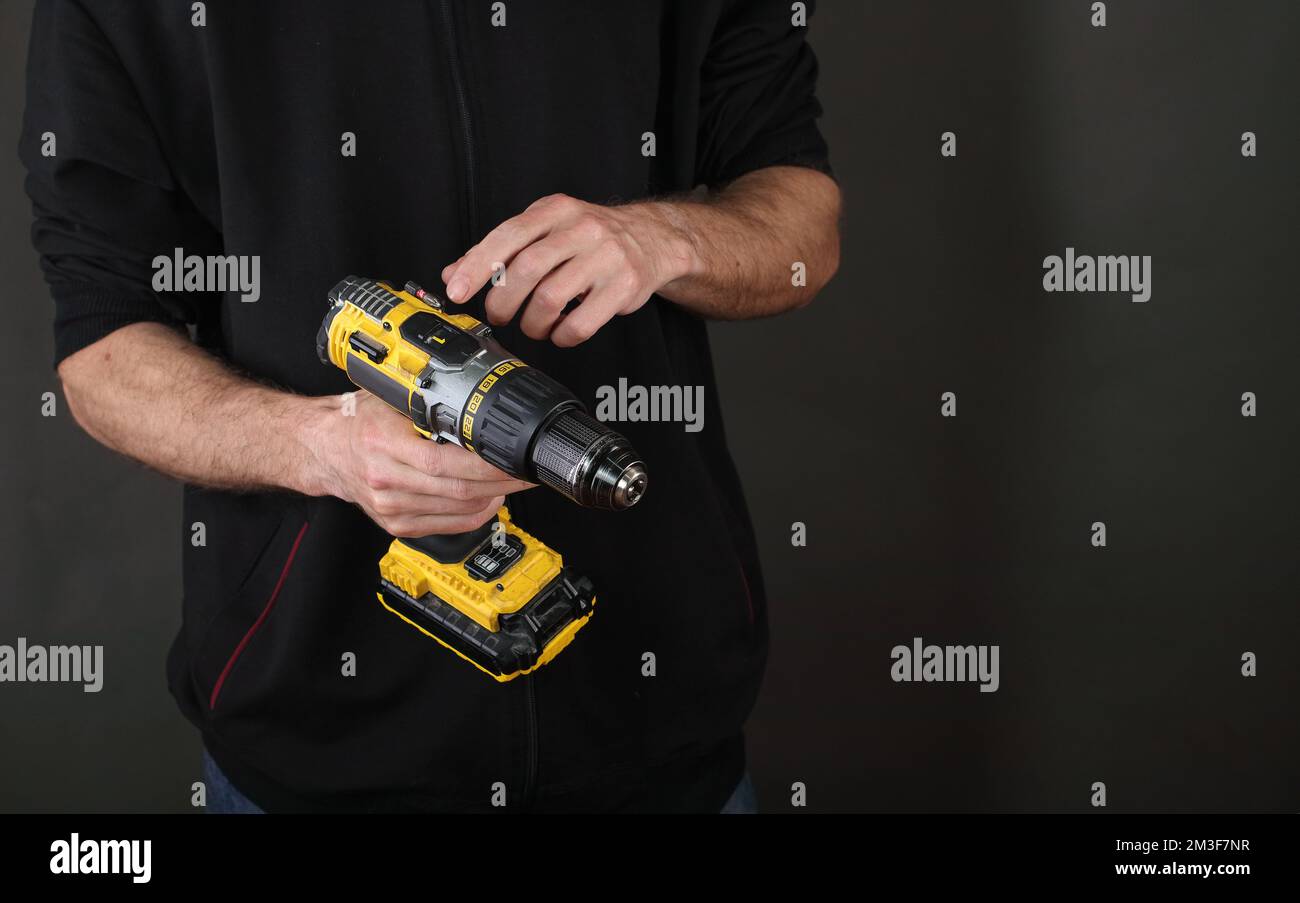 Person holding screwdriver hi-res stock photography and images - Alamy