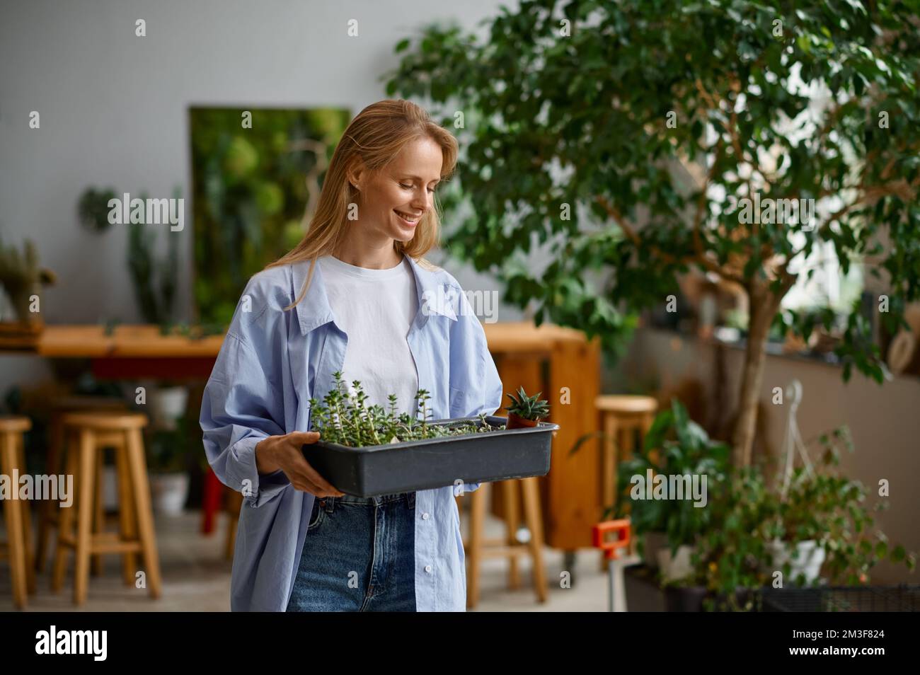 Female florist walking in flower hi-res stock photography and images ...