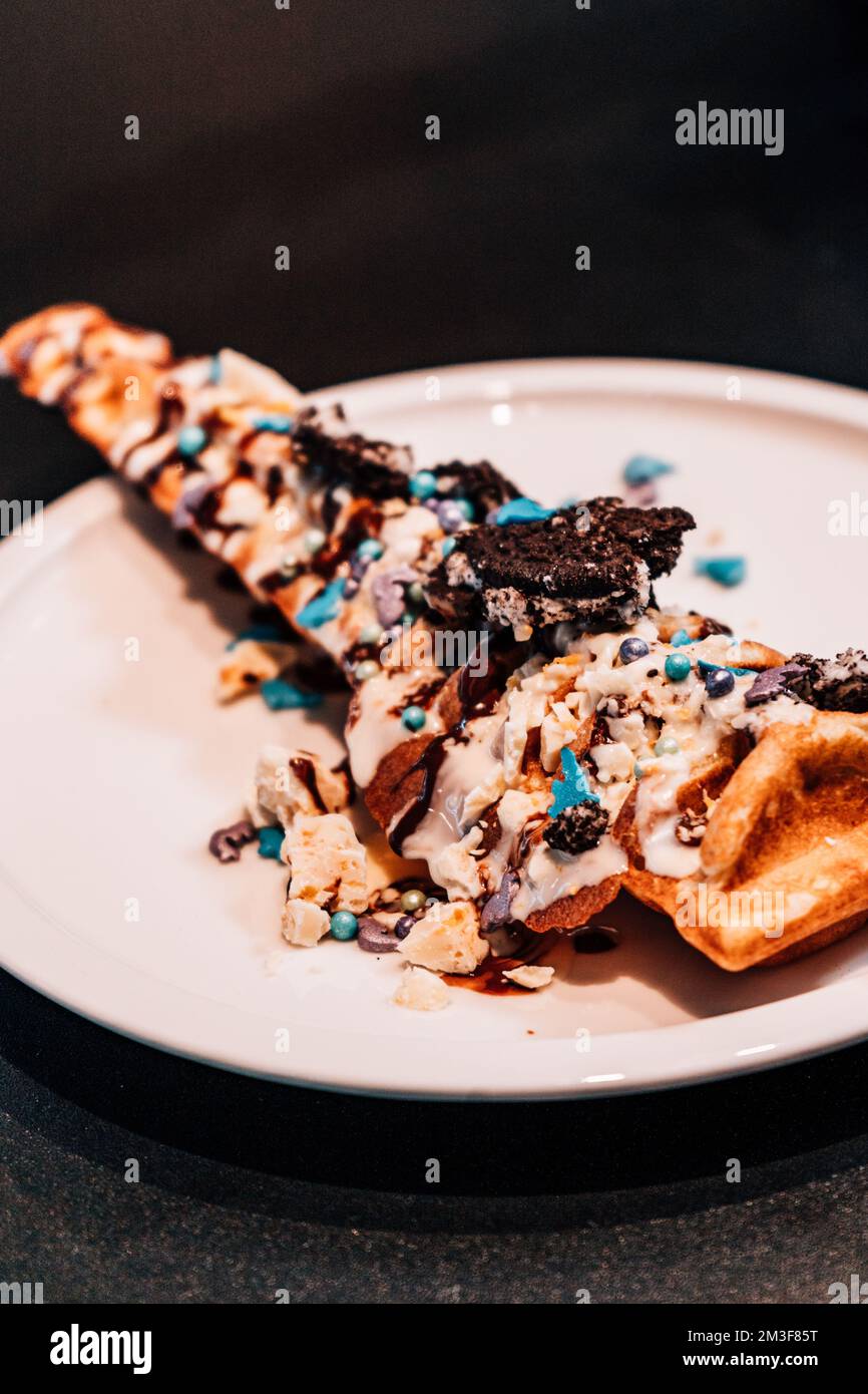 A closeup of a waffle with a sweet topping, a vertical shot Stock Photo ...