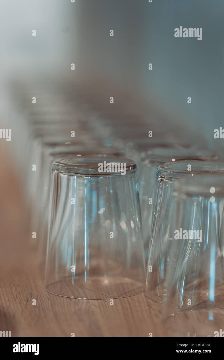 The empty glass cups on a wooden table Stock Photo - Alamy