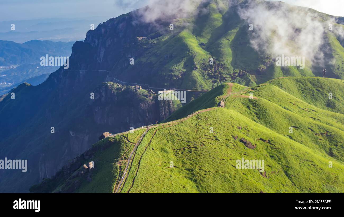 The beautiful peak of the Wugong mountain covered with white clouds in ...