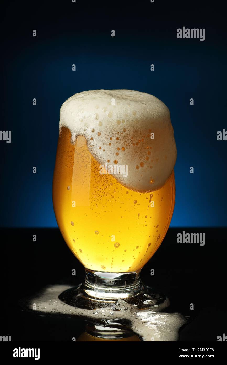 Small glass beer overflowing hi-res stock photography and images - Alamy