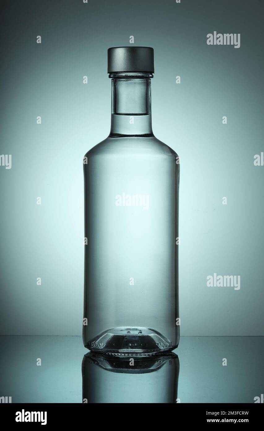 bottle of pure vodka with a gradient on a light background Stock Photo - Alamy