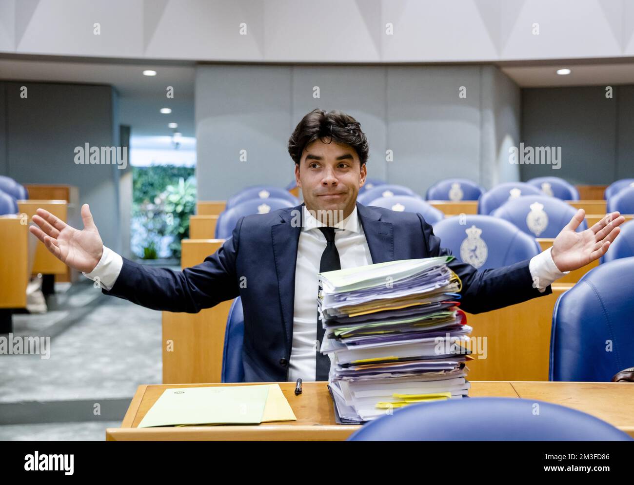 THE HAGUE - Leon de Jong (PVV) shows a stack of dossier documents prior ...