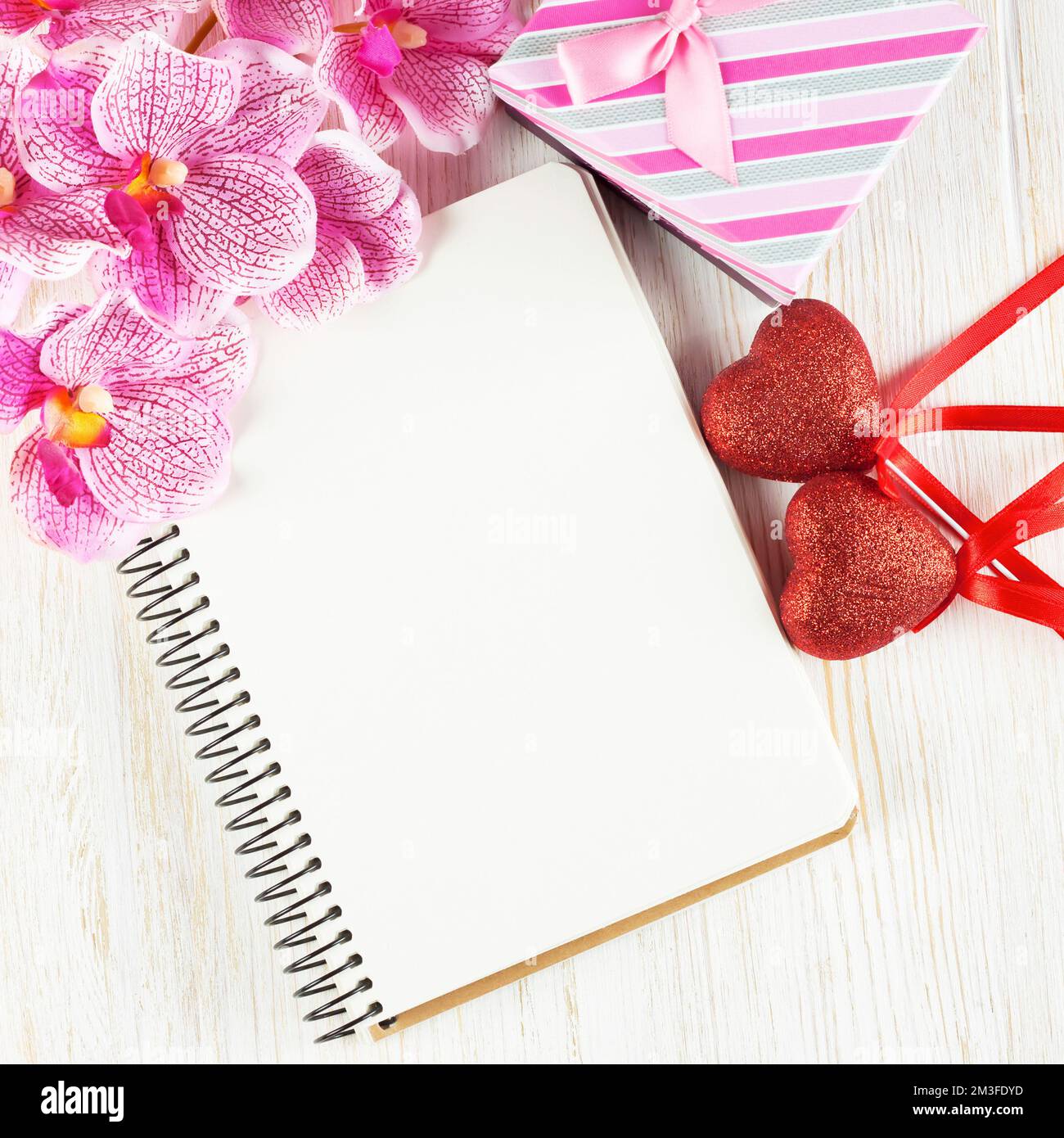 Valentines Day background with empty notepad for text, giftbox, pink ...