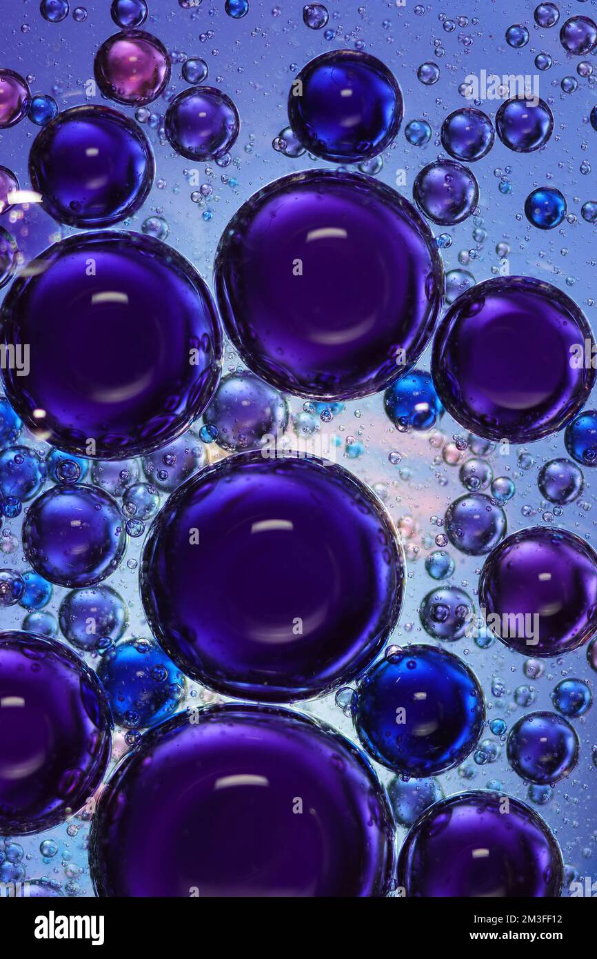 oil bubbles with water on a colored background Stock Photo - Alamy