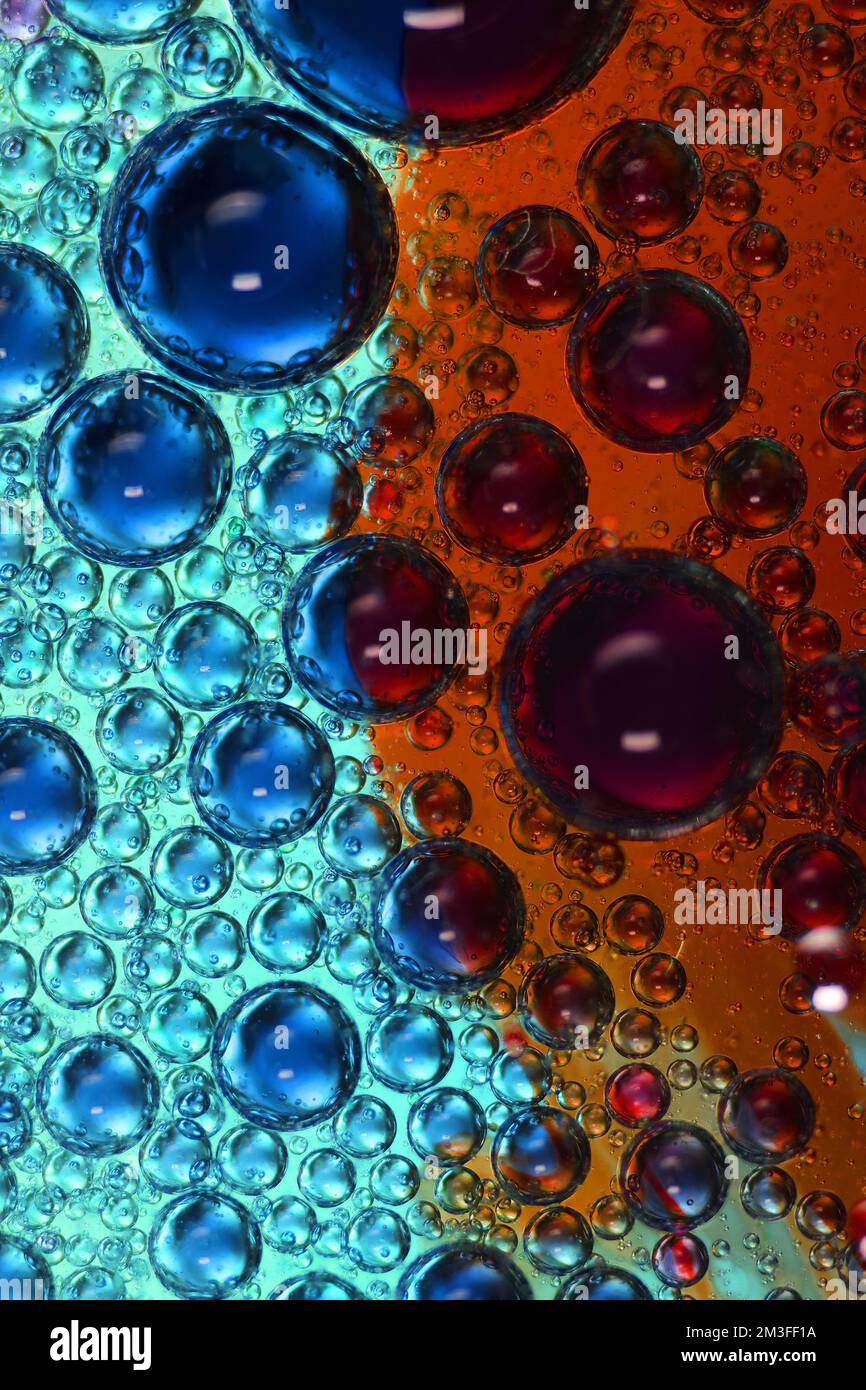 oil bubbles with water on a colored background Stock Photo - Alamy