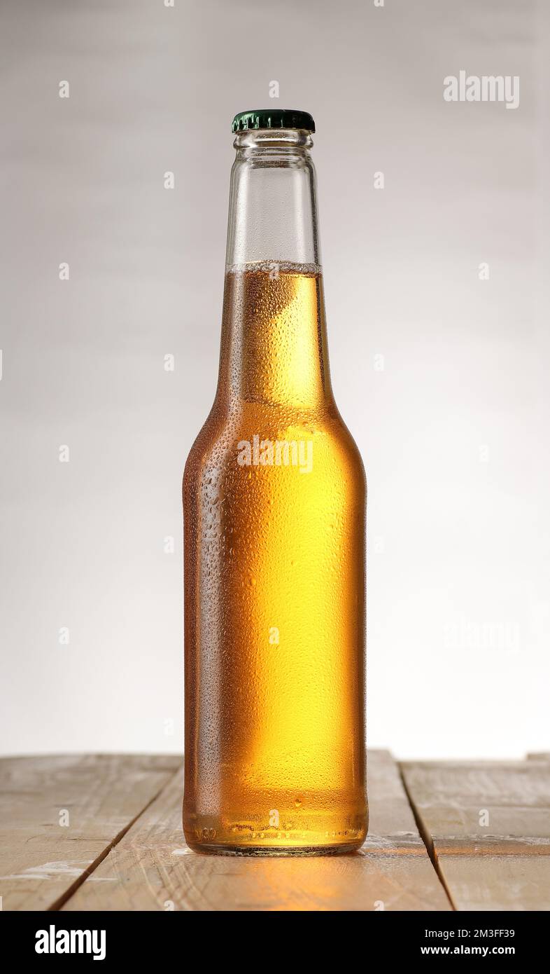 full bottle of light beer on a white background Stock Photo - Alamy