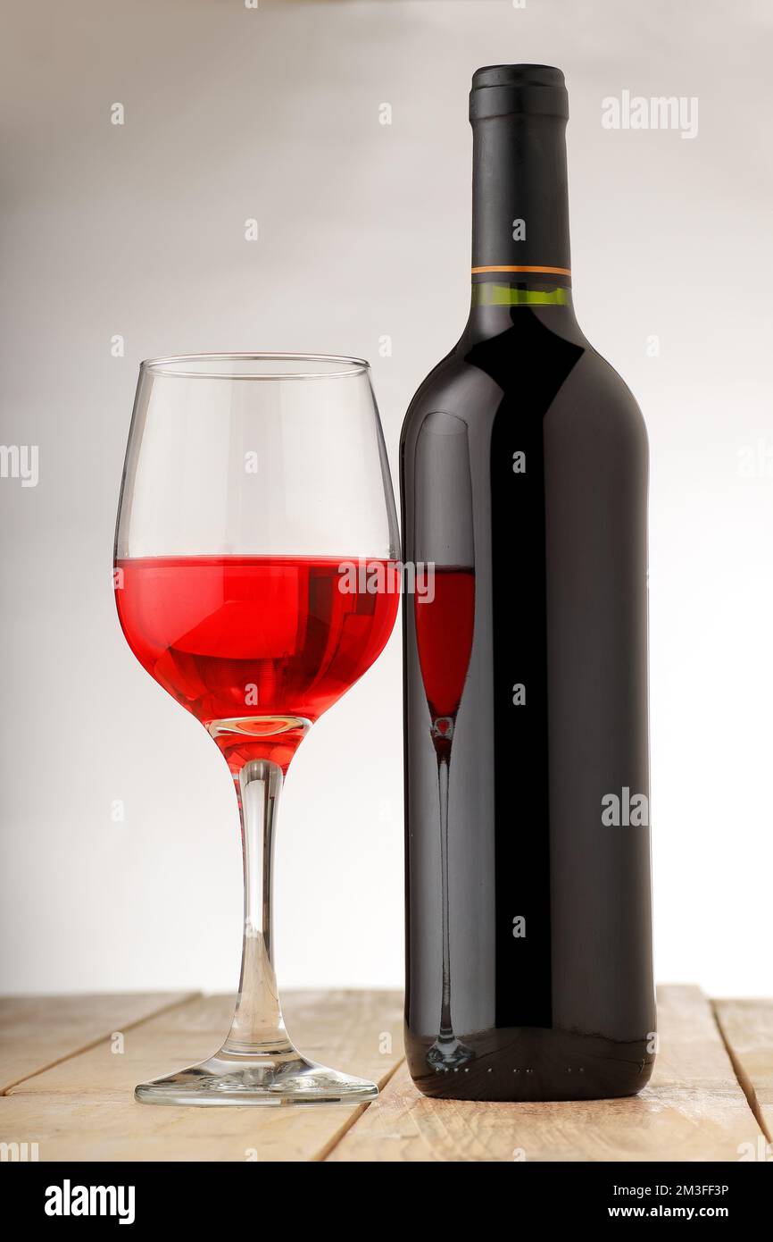 wine goblet with bottle on white background Stock Photo - Alamy