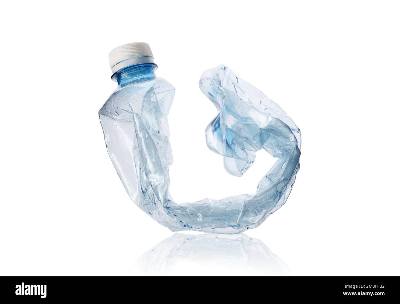 crushed plastic bottle of mineral water on white background Stock Photo ...