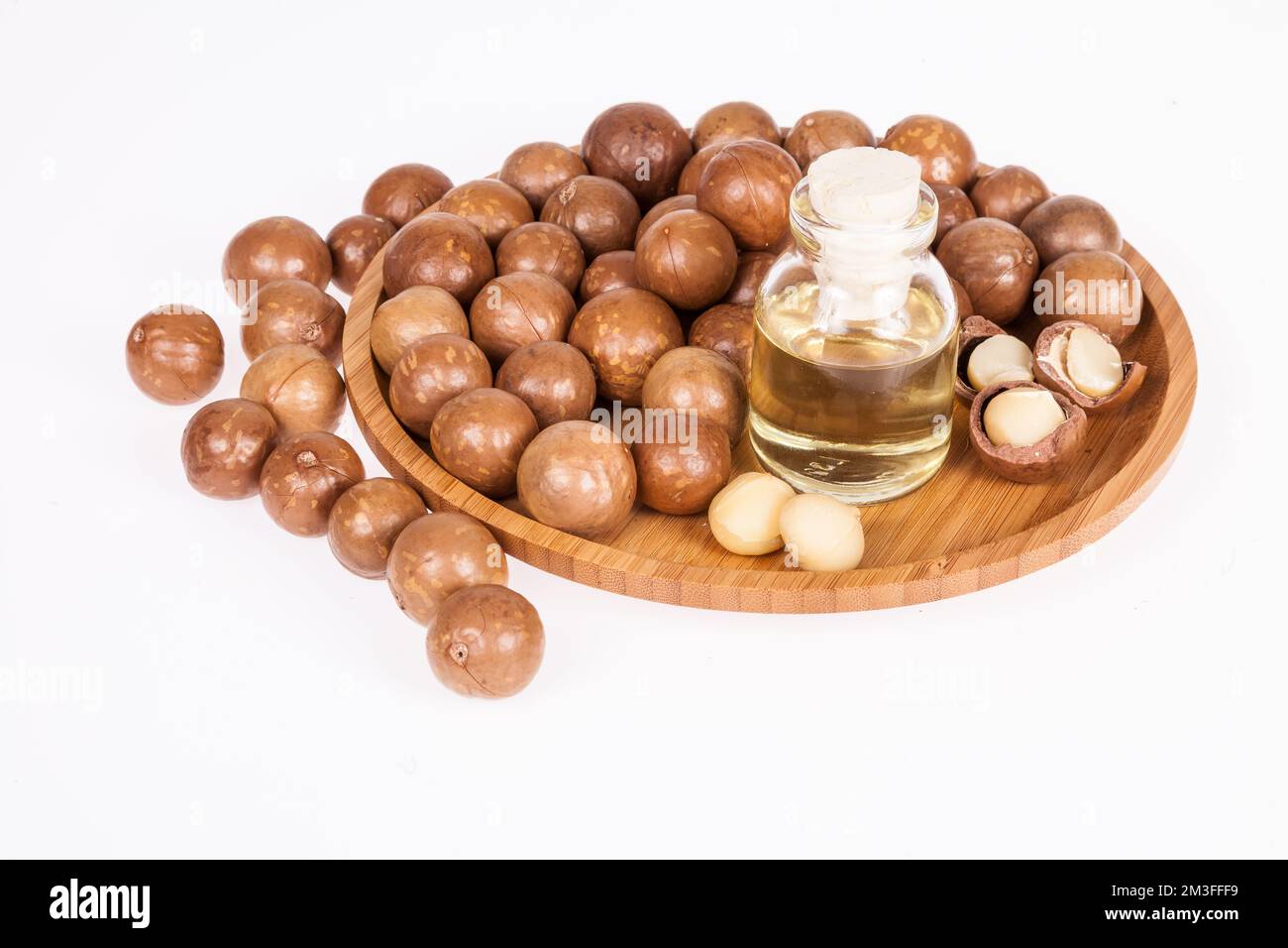 Macadamia nuts oil or Australian walnuts on white background Stock ... Macadamia nuts oil or Australian walnuts on white background Stock ...