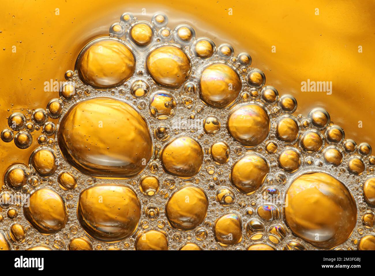 high magnification soap bubbles on golden background Stock Photo - Alamy