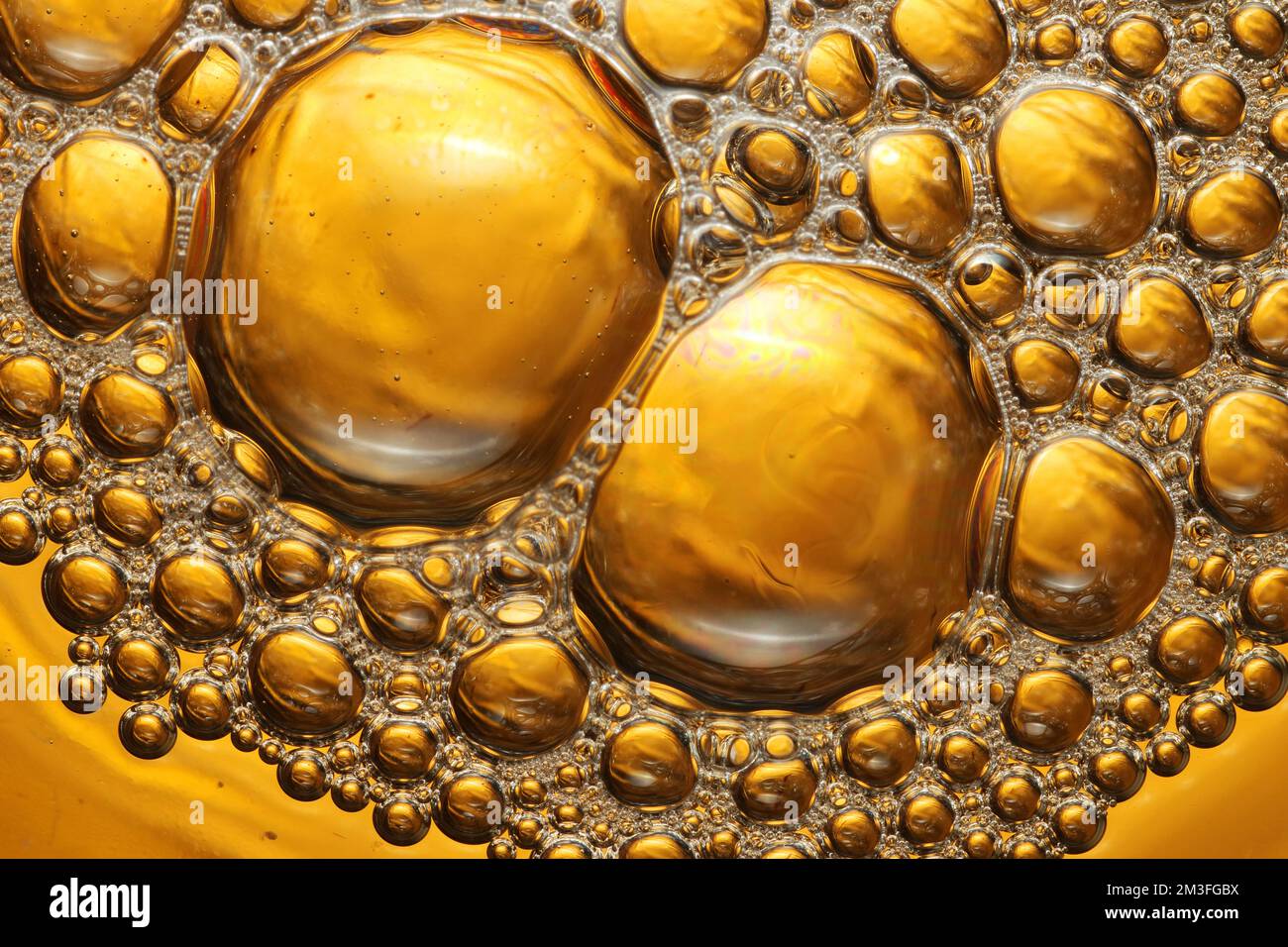 high magnification soap bubbles on golden background Stock Photo - Alamy