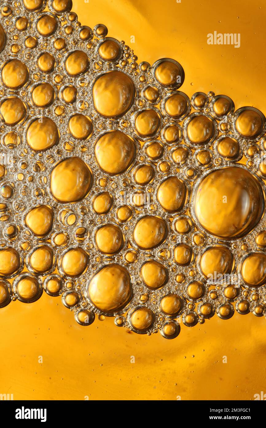 high magnification soap bubbles on golden background Stock Photo - Alamy