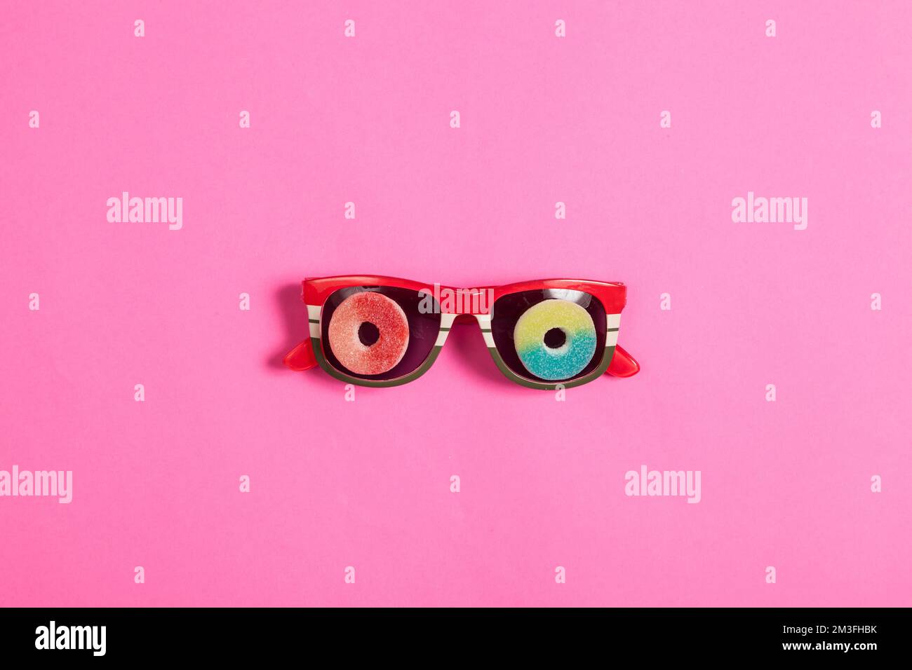 Funny Photo; Eyeglasses With Jelly Beans On The Lenses Stock Photo - Alamy