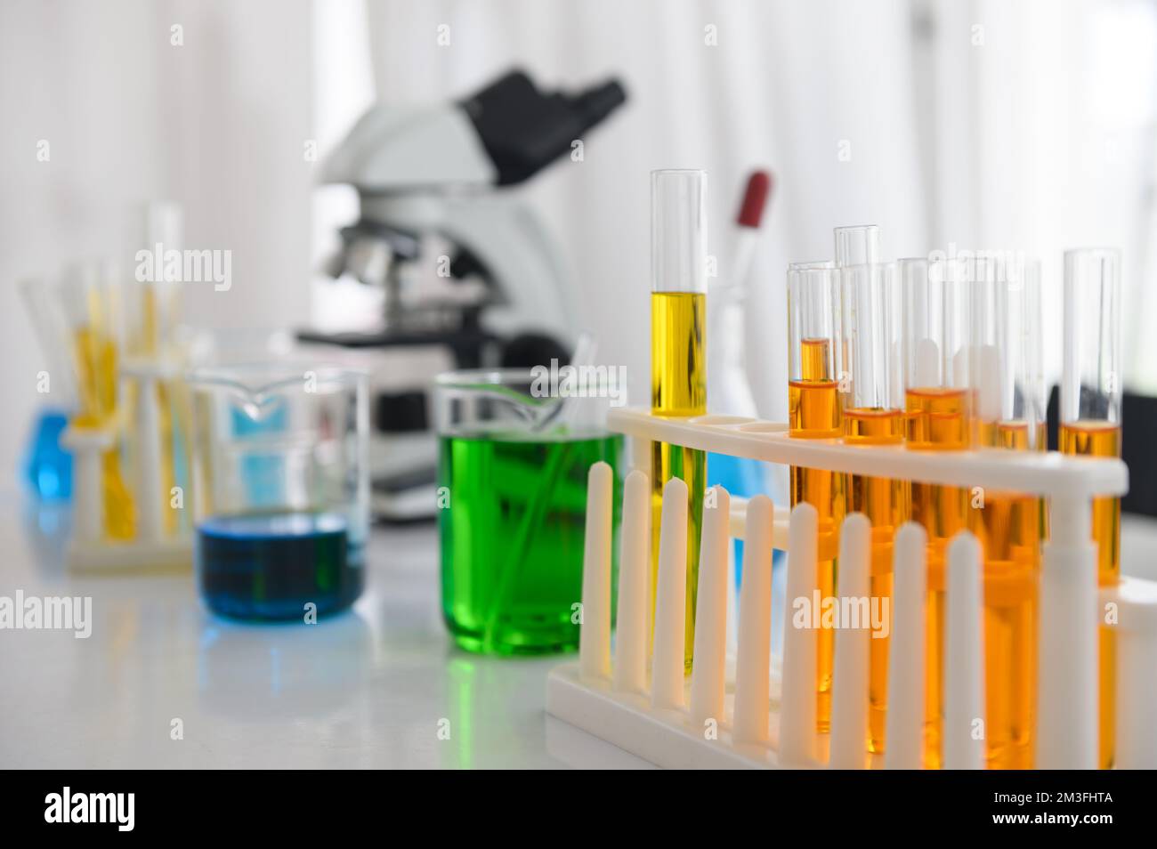 Chemistry test tubes on the table with colorful liquids Stock Photo - Alamy