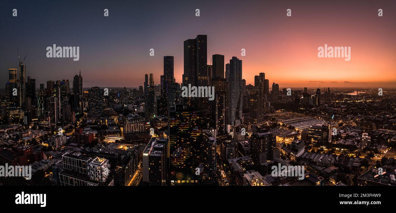 A high-angle of Melbourne cityscape at sunset purple and dark sky ...