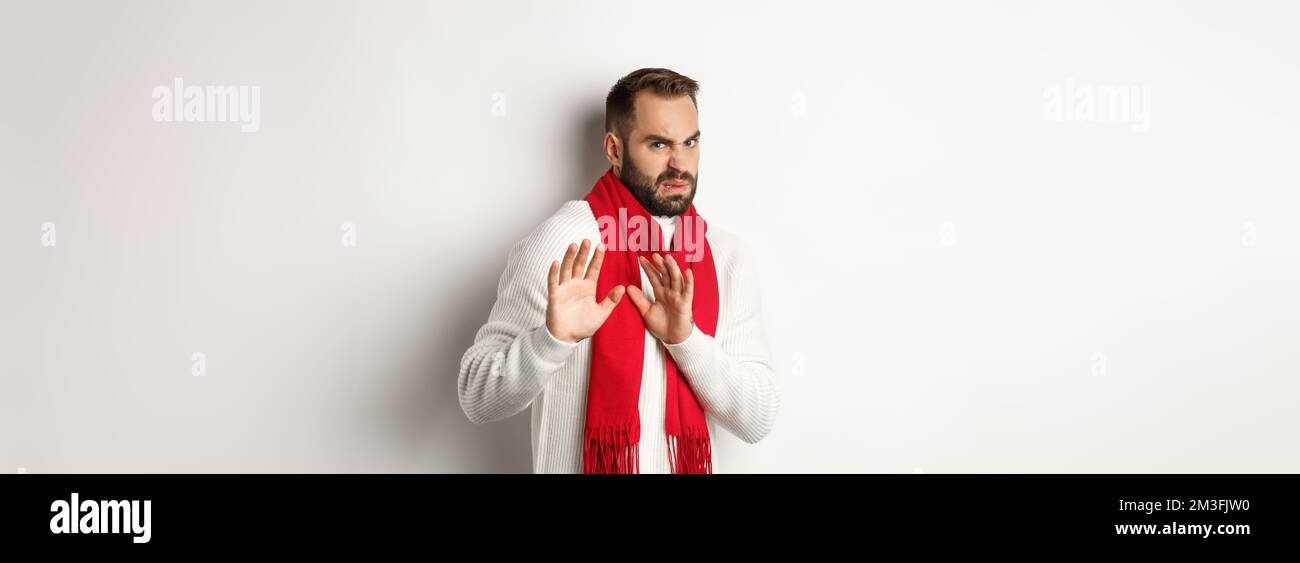 Displeased bearded man asking to stay away, showing decline and stop ...