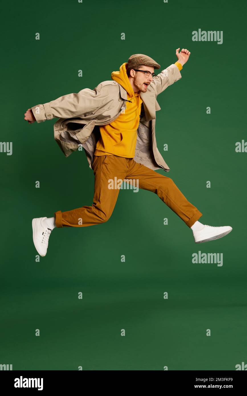 Portrait of young stylish man in trendy autumn clothes posing isolated ...