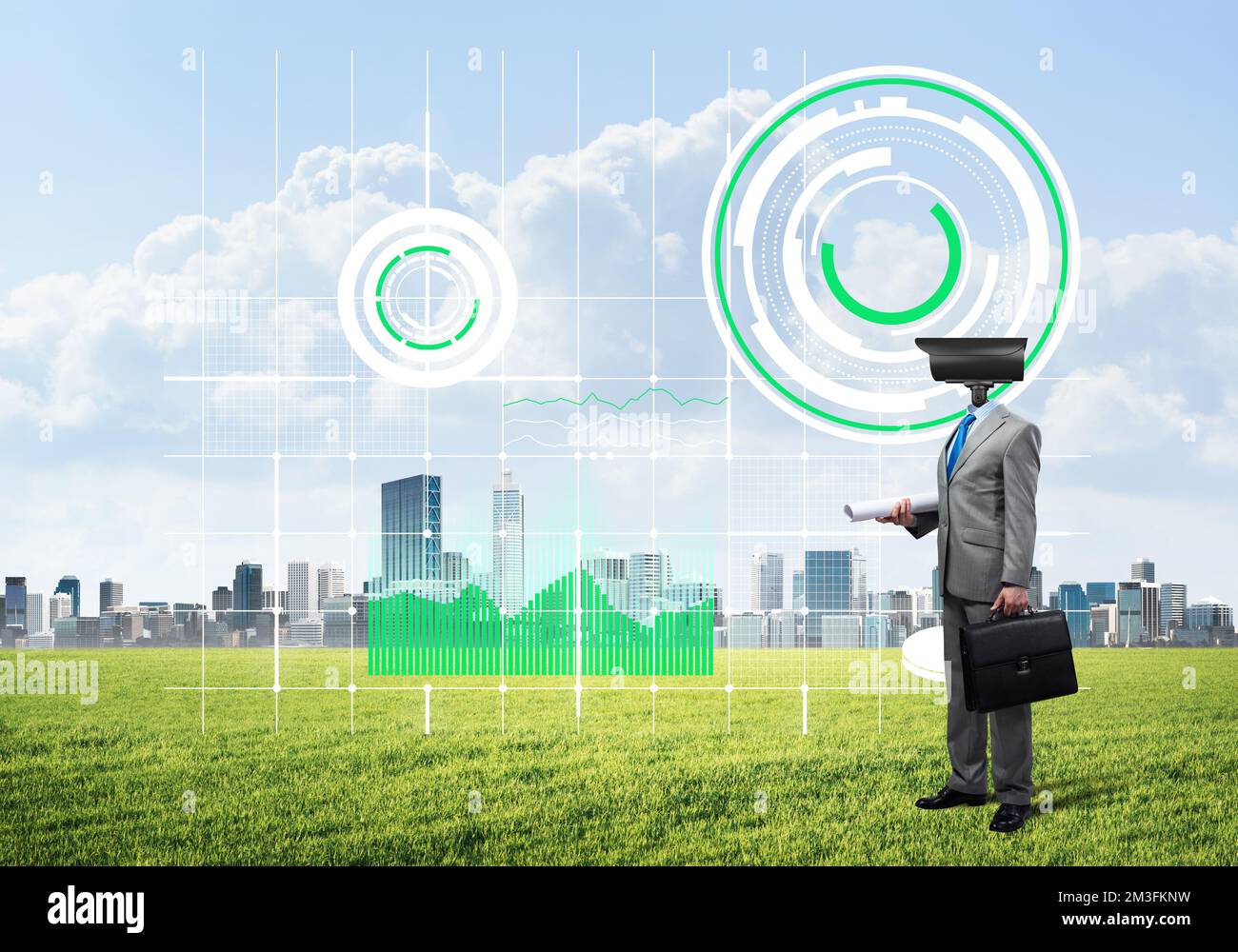 Camera headed man standing on green grass against modern cityscape ...