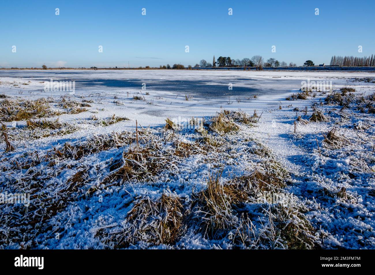 Welney, England. 15 December, 2022. The frozen Welney Washes in Norfolk ...