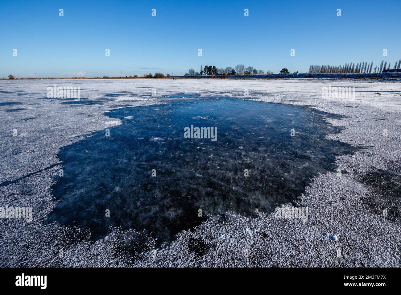 Welney, England. 15 December, 2022. The frozen Welney Washes in Norfolk ...
