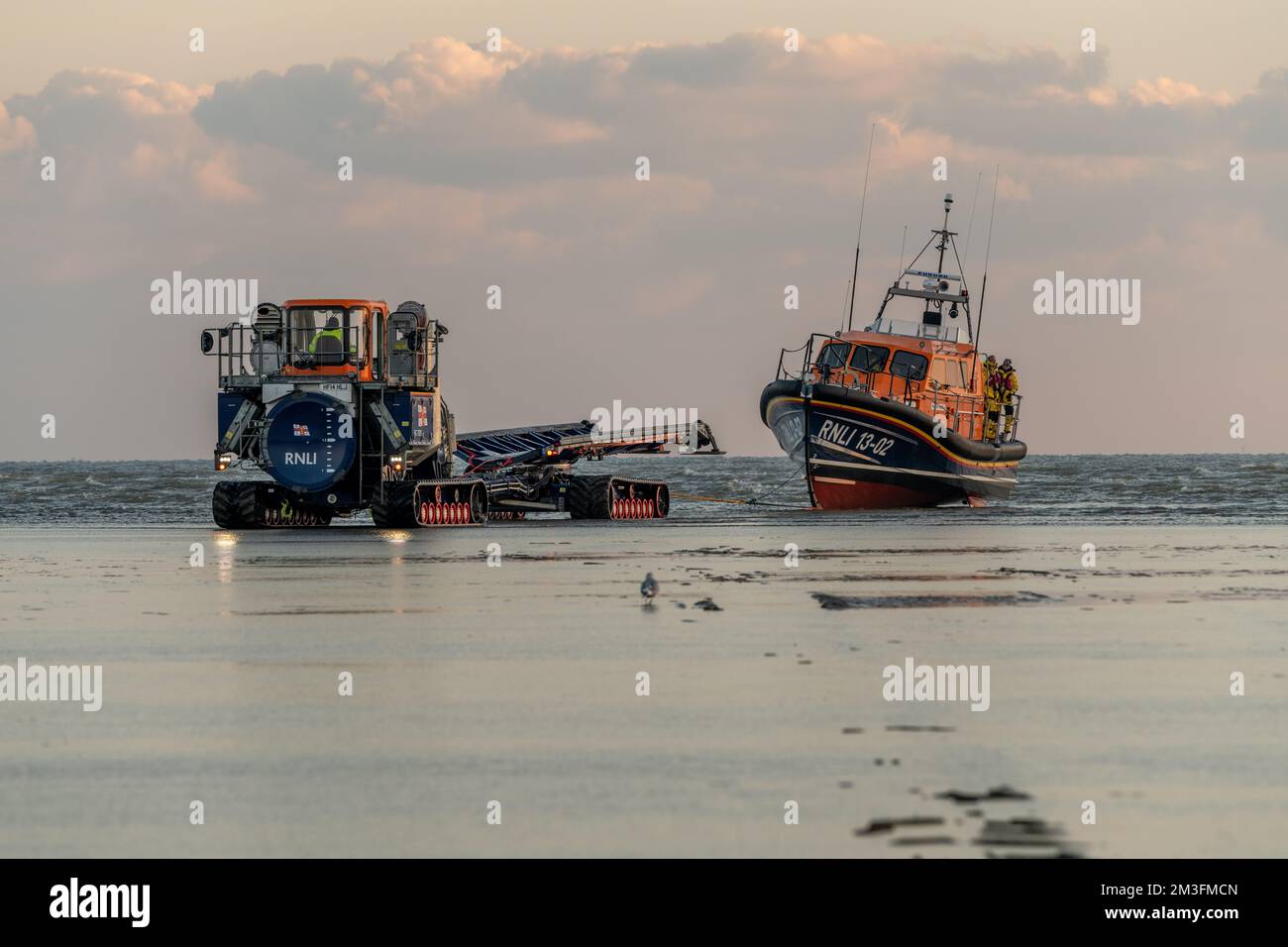 Rnli lifeboat and coastguard helicopter look for capsized boat hi-res ...