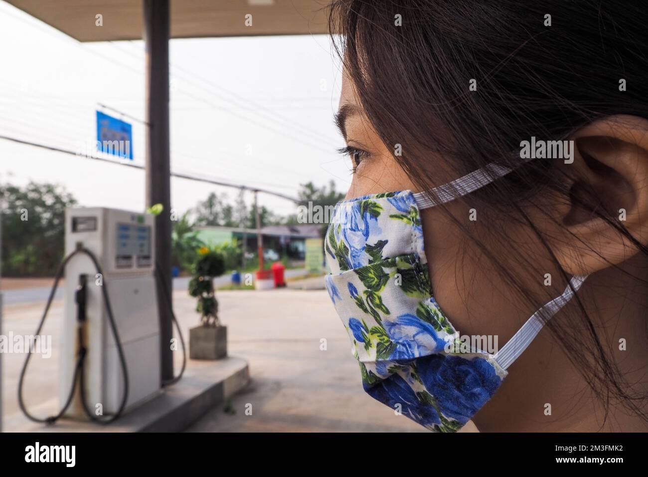 Woman wearing a purple floral mask and expressing feelings Stock Photo ...