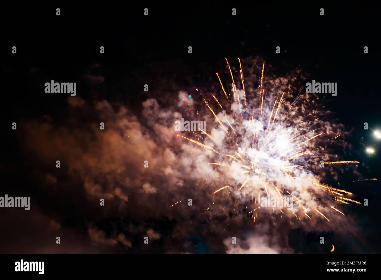 Bright light flash of fireworks, against the background of the night ...