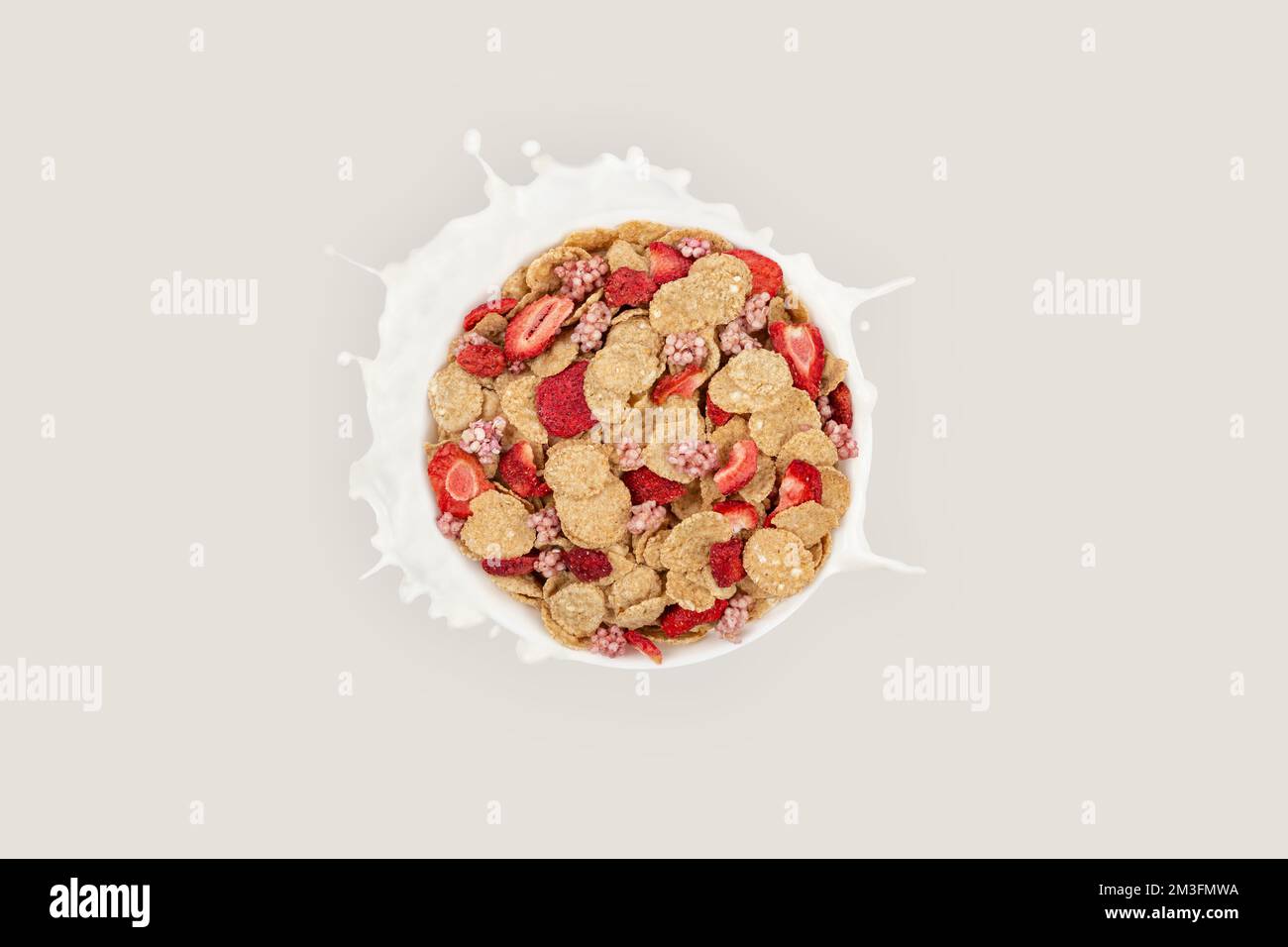 wheat spike next to bowl of dry strawberry corn flakes Stock Photo - Alamy