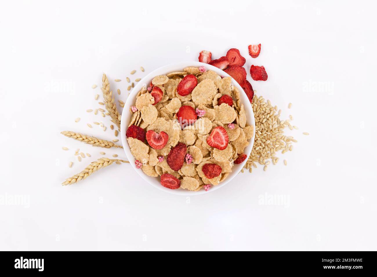 wheat spike next to bowl of dry strawberry corn flakes Stock Photo - Alamy