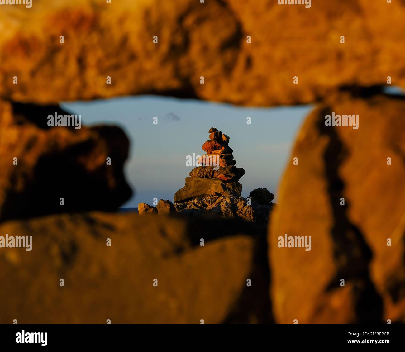 Stone sculpture photographed through wall at golden hour, Kreta, Greece ...