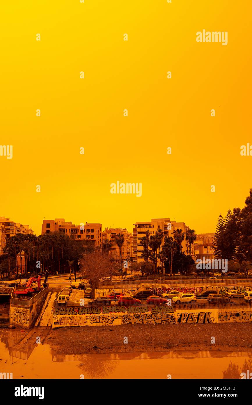 Guadalmedina river and its embankment covered by orange dust storm ...