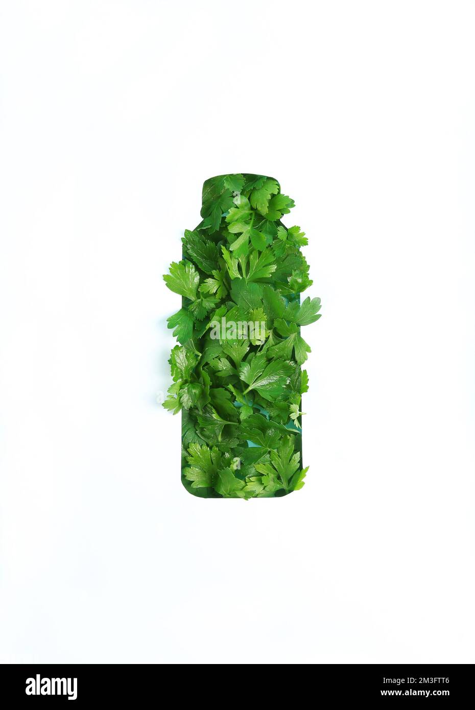 parsley in bottle form on a white background Stock Photo - Alamy