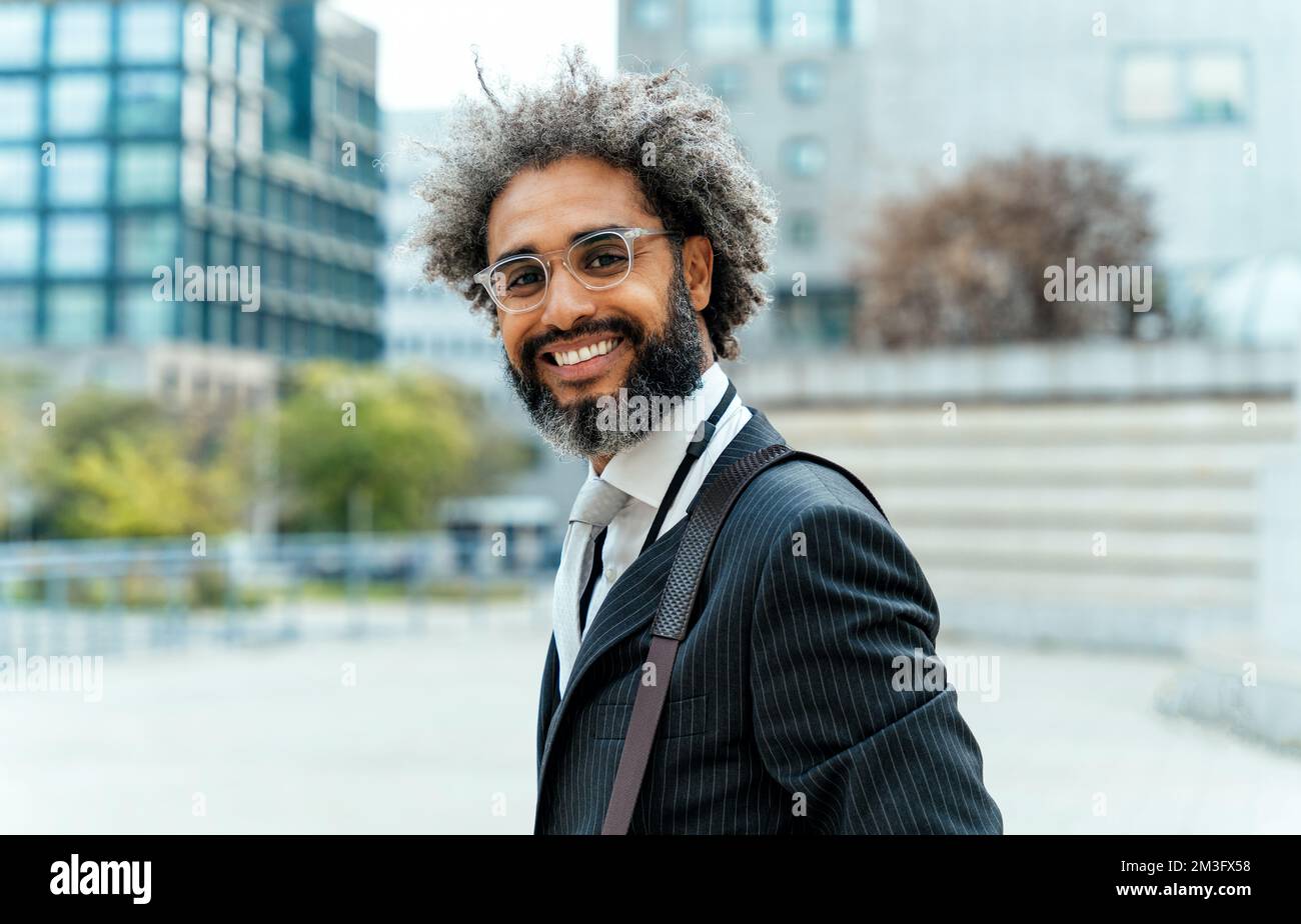 Young entrepreneur business man walking outside his office after a busy ...