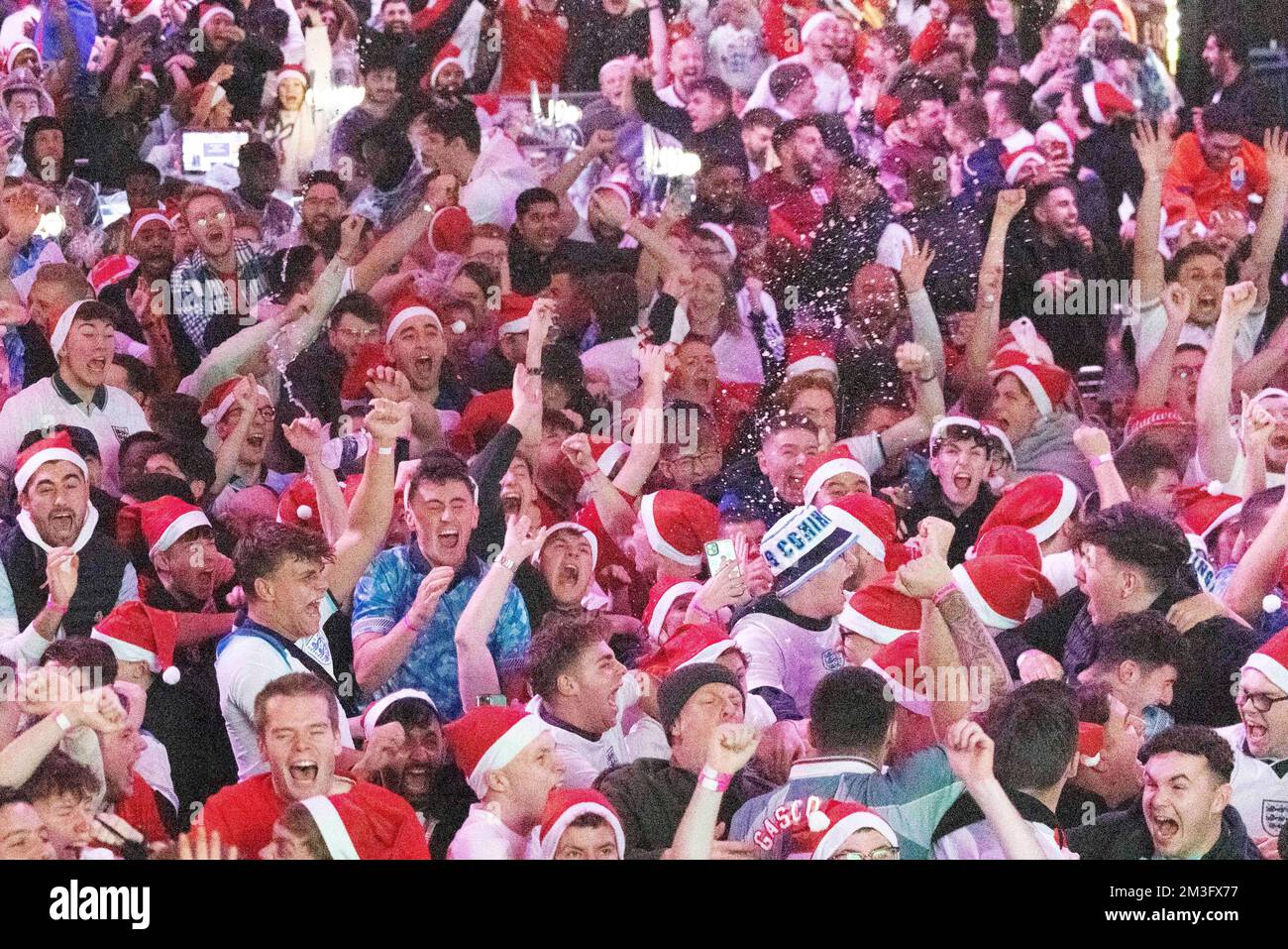 England fans throw beer in the air at Boxpark, Wembley, London, as ...