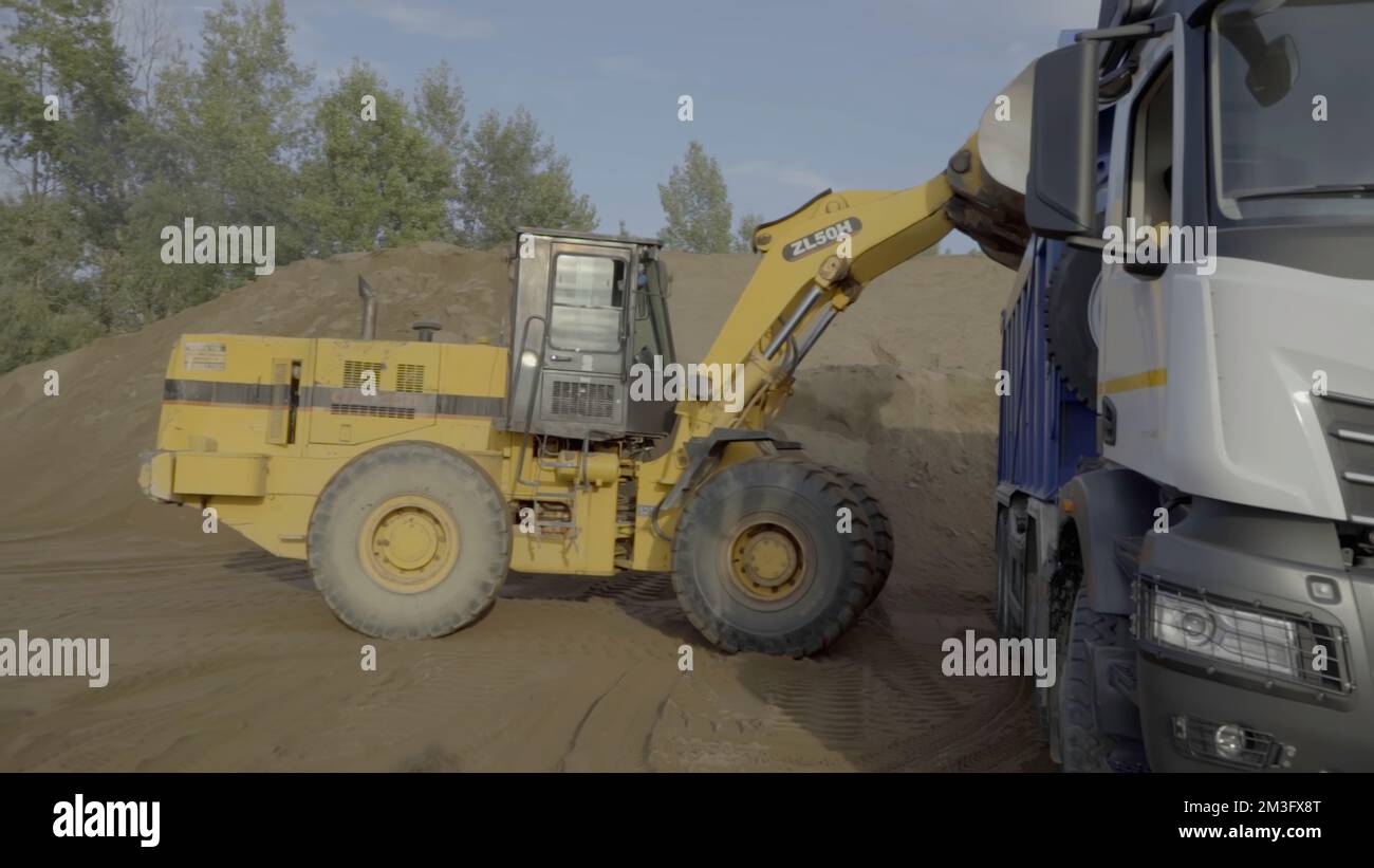Berlin, Germany - June 20, 2022: Different machines work at a stone ...