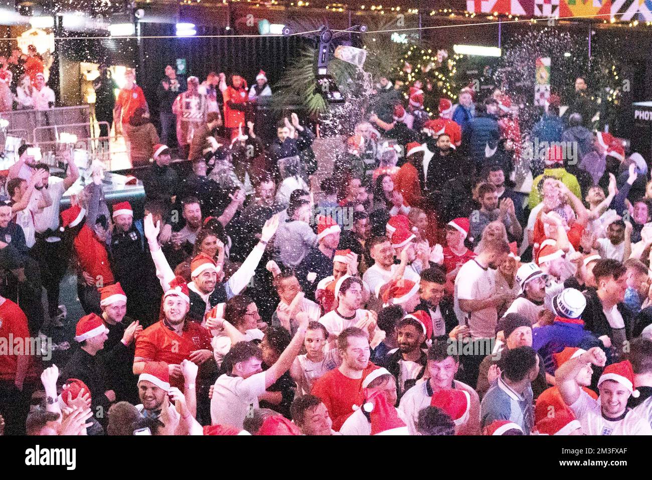 England fans throw beer in the air at Boxpark, Wembley, London, as ...